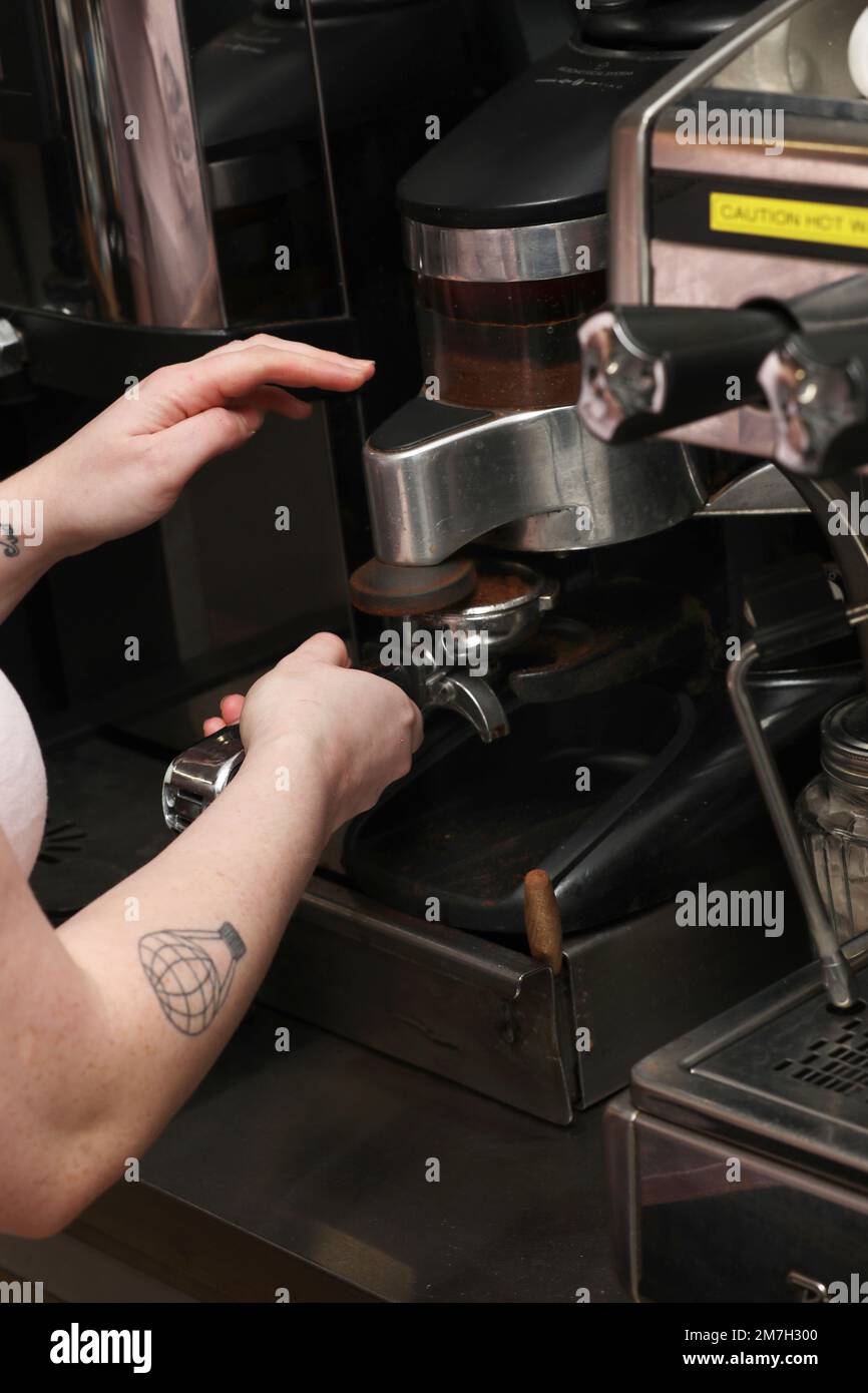 Coffee being made in a cafe in Chichester, West Sussex, UK Stock Photo ...
