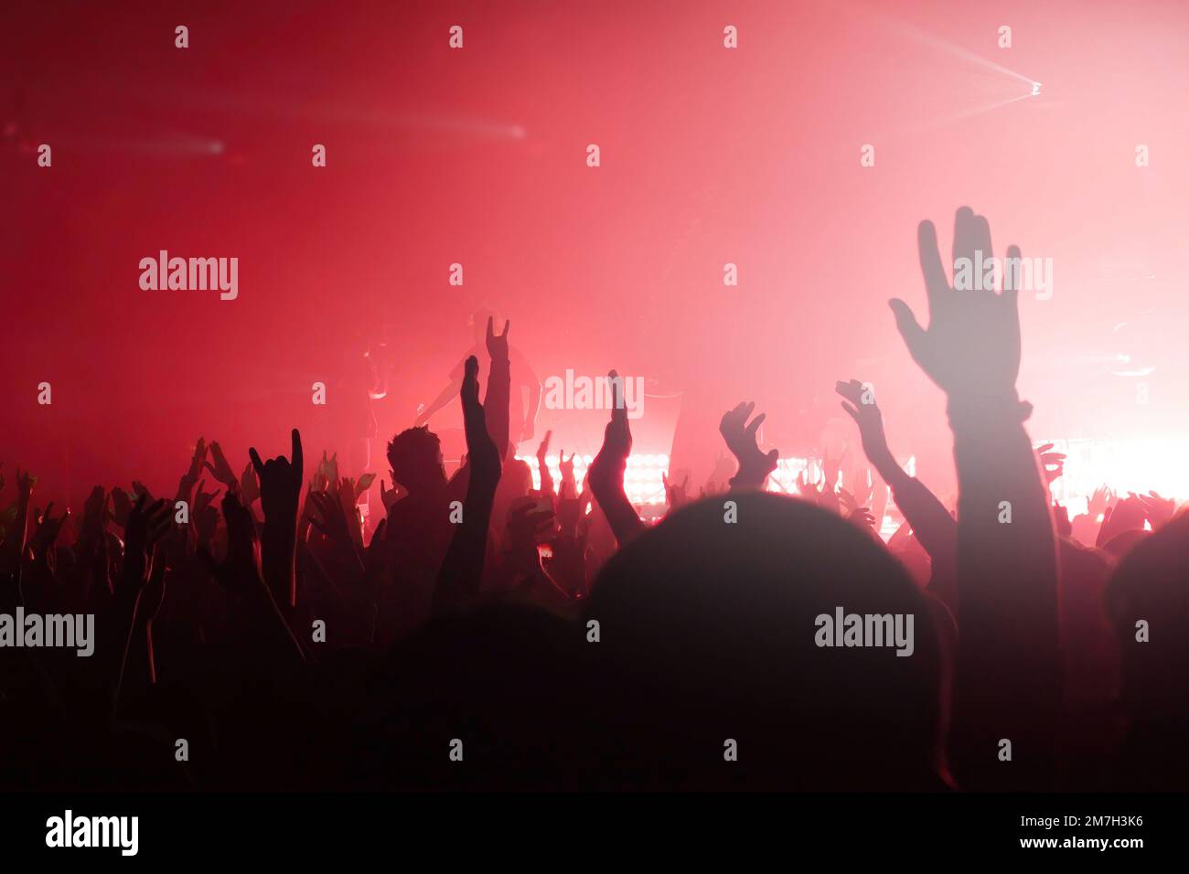 Hands up place for text. Fans are screaming. Teenagers at a concert ...