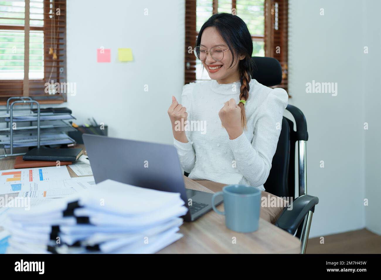 Portrait of a woman business owner showing a happy smiling face as he ...