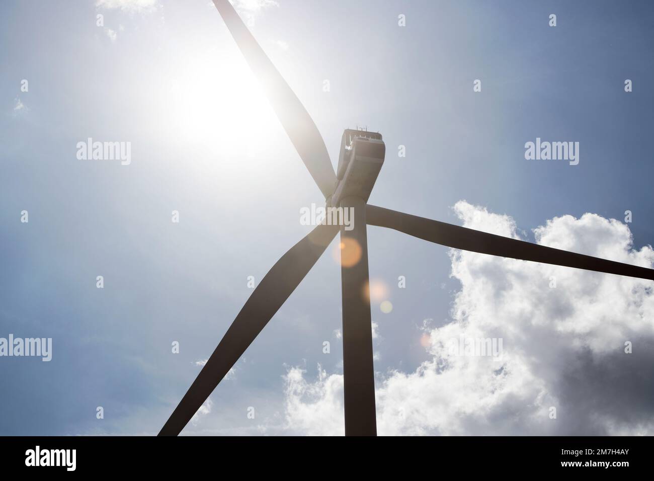 a modern wind turbine in sun rays Stock Photo - Alamy