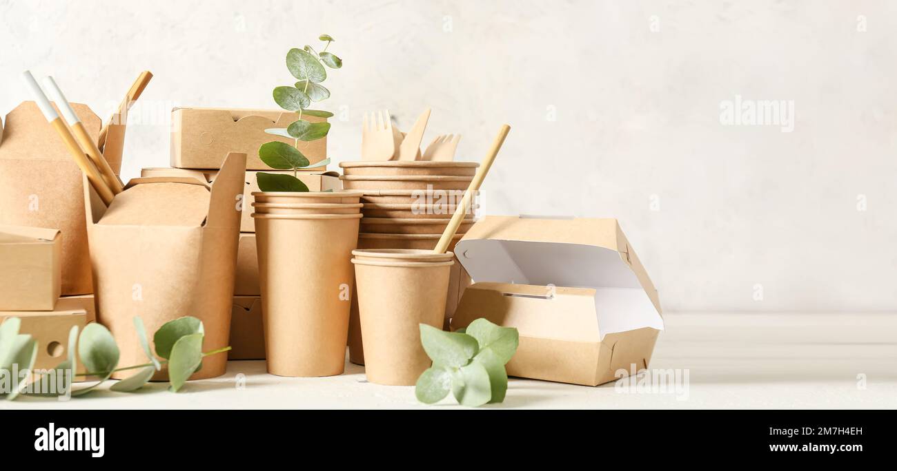 Eco containers for food and drinks on light background Stock Photo - Alamy