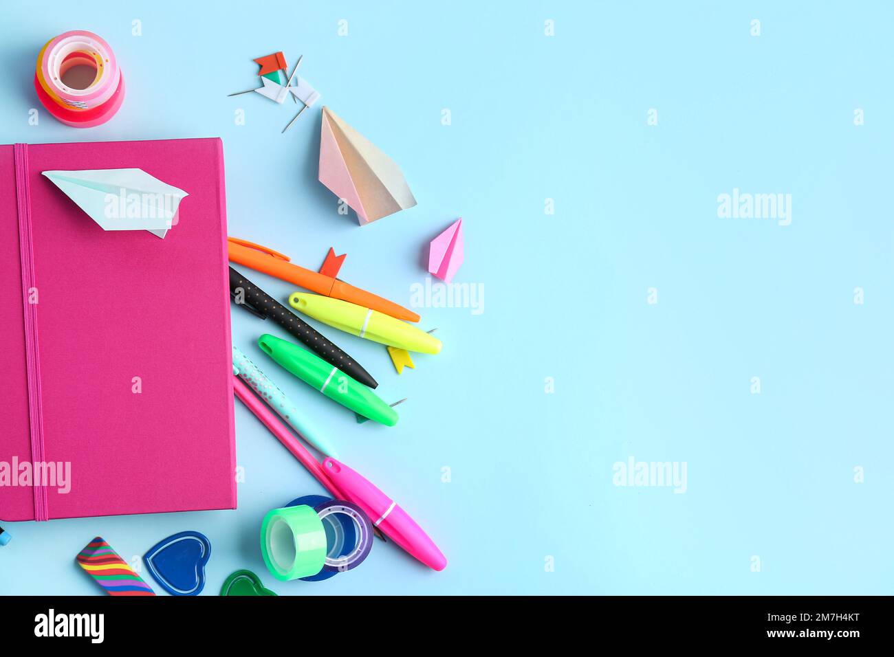 Composition with notebook and different stationery on color background ...