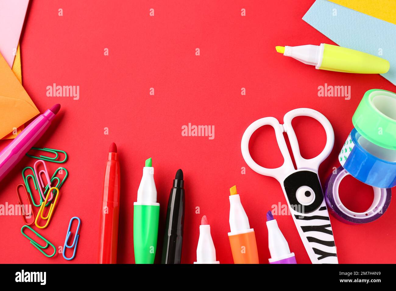 Set of stationery on red background Stock Photo - Alamy