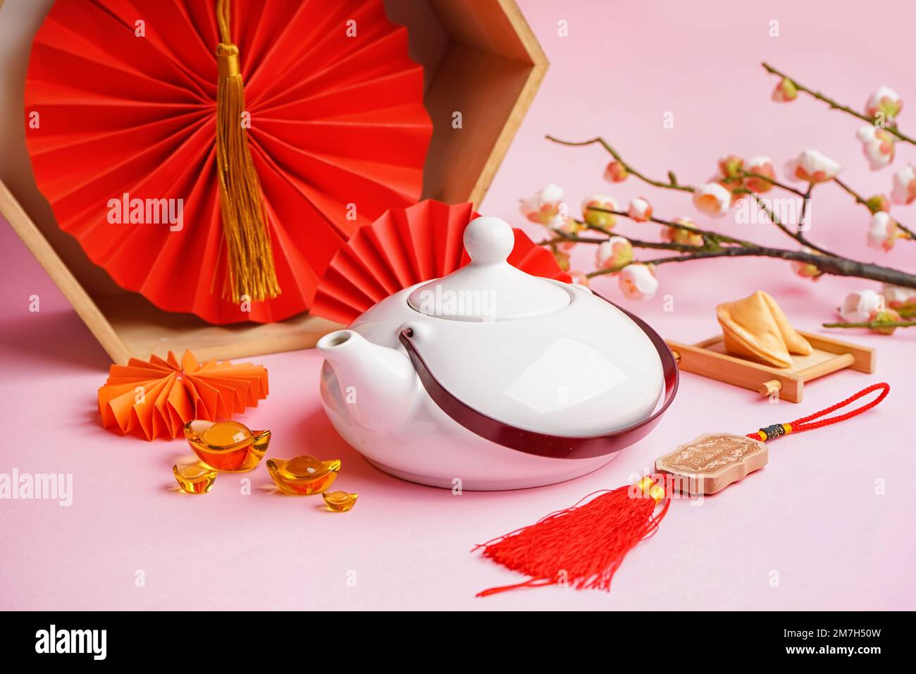 Teapot and Chinese symbols on pink background Stock Photo - Alamy