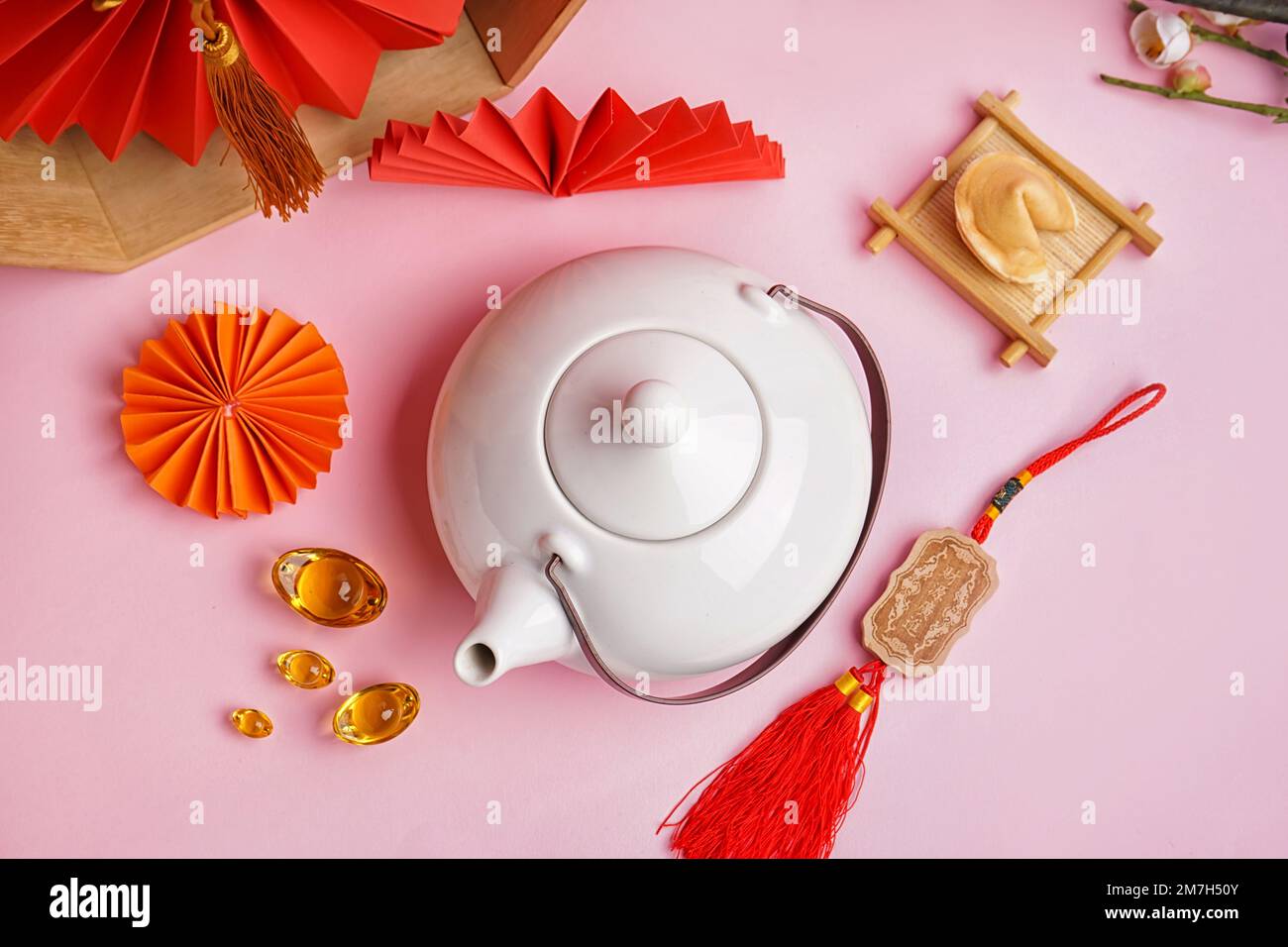 Teapot and Chinese symbols on pink background Stock Photo - Alamy