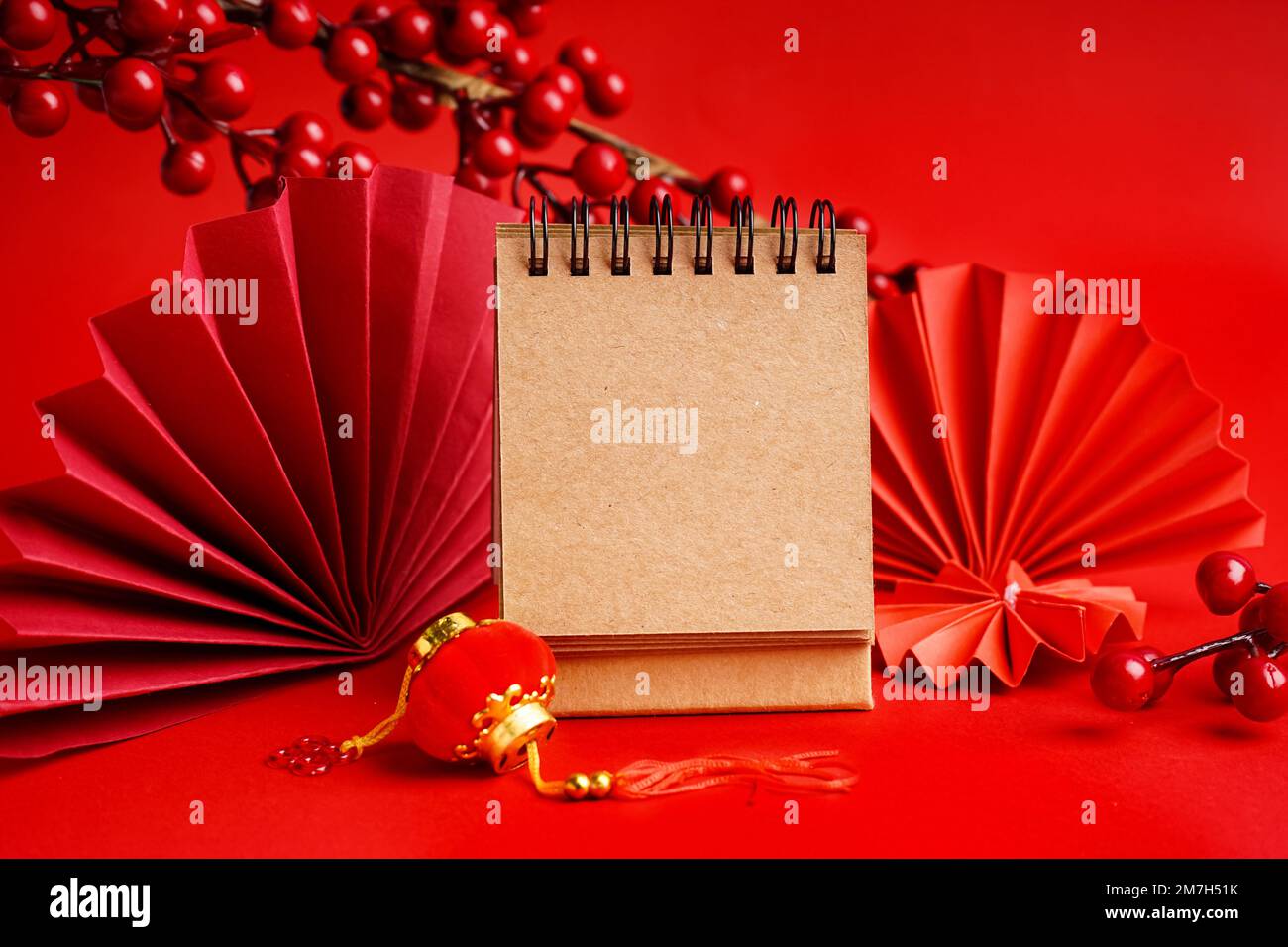 Blank notebook and Chinese symbols on red background Stock Photo - Alamy