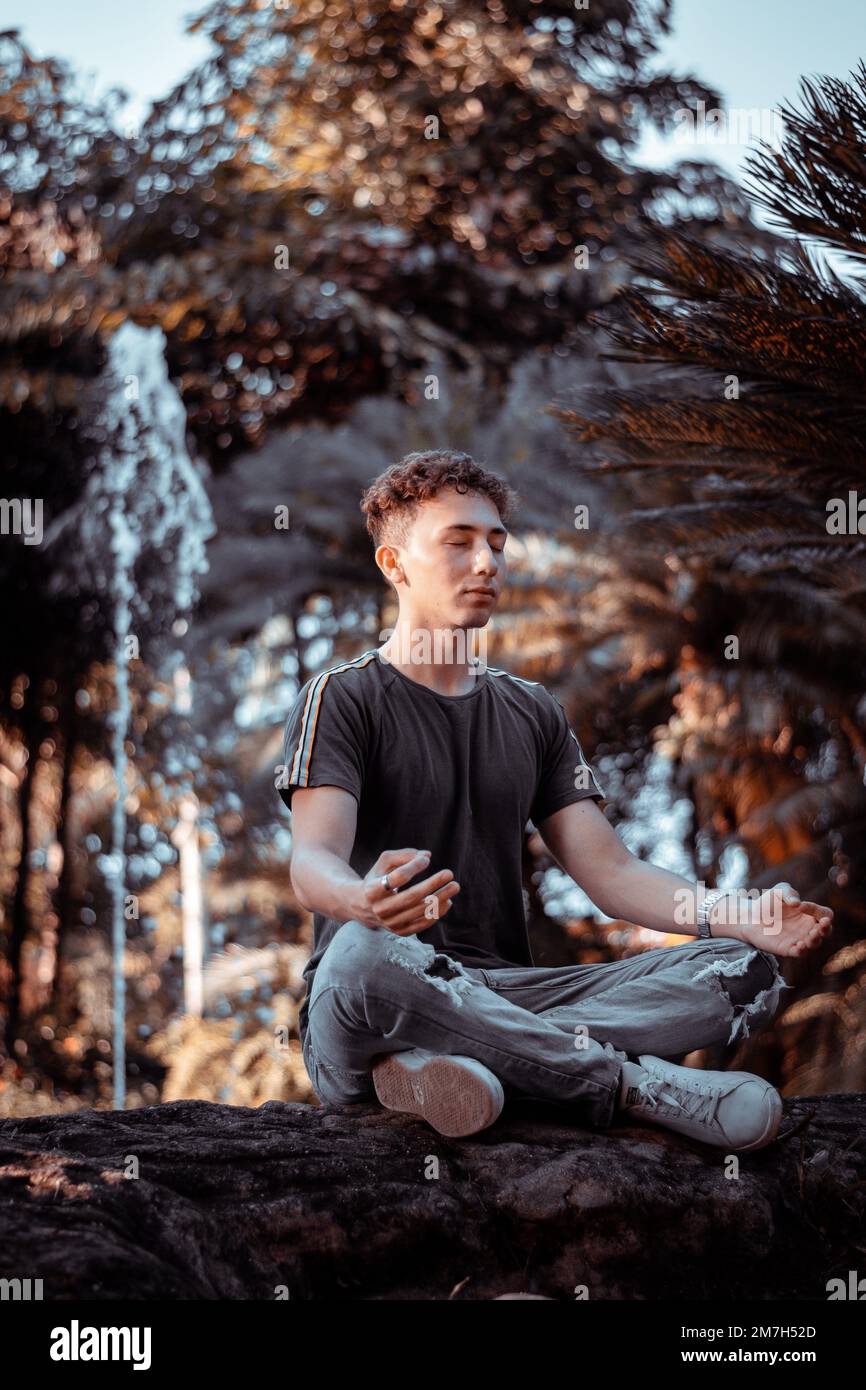 Meditating meditate hi-res stock photography and images - Alamy