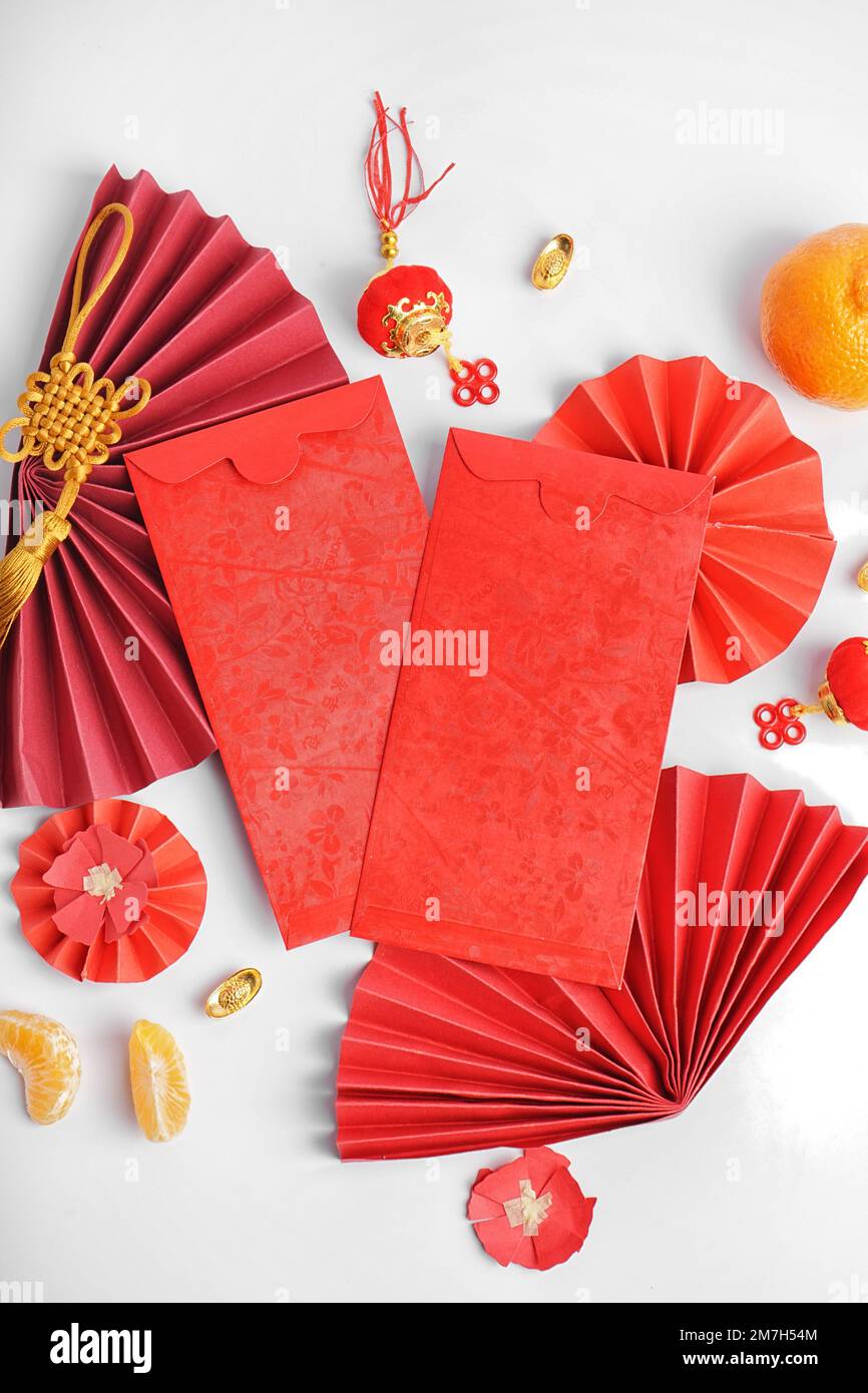 Red envelopes and Chinese symbols on white background Stock Photo - Alamy