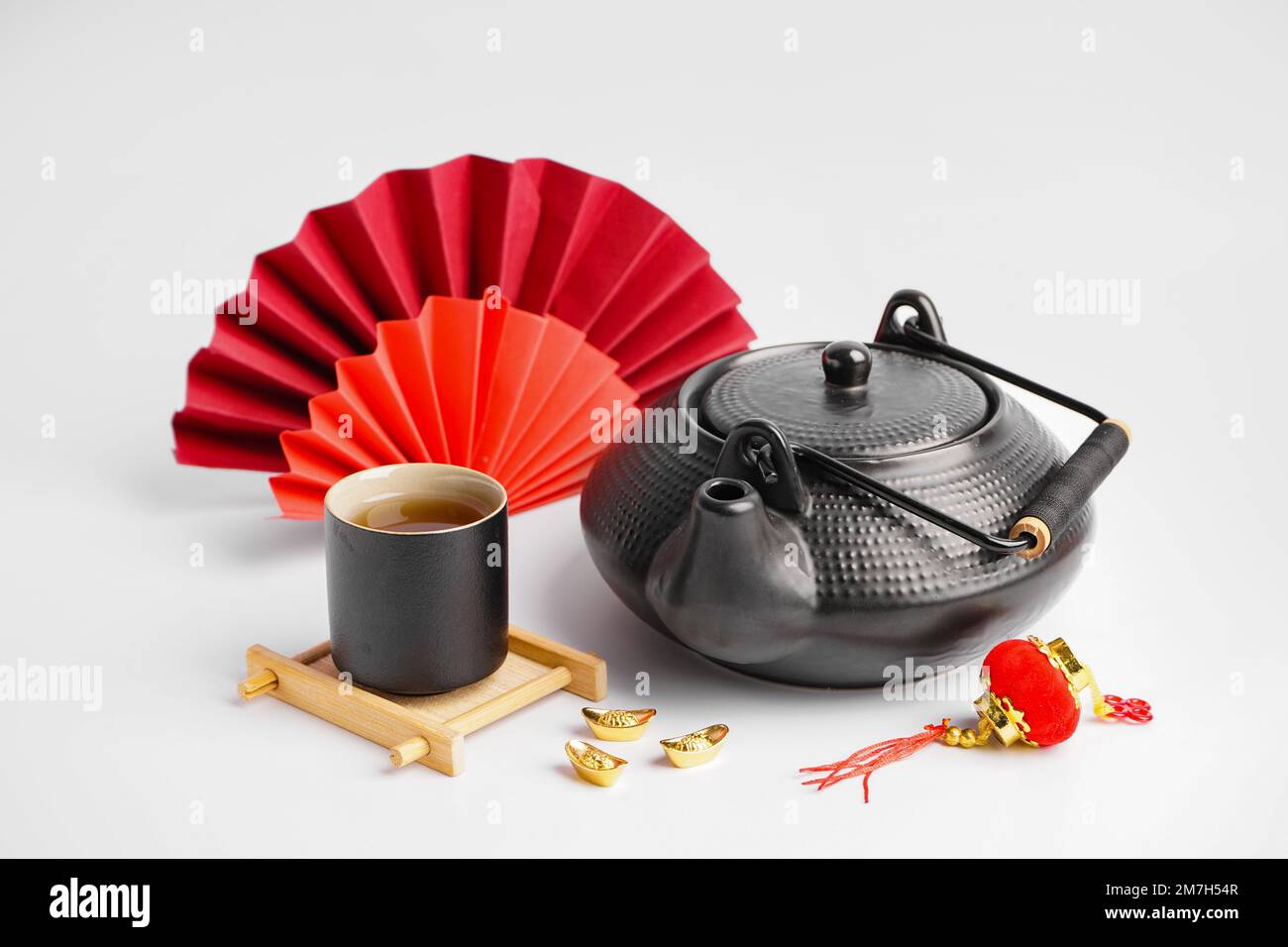 Teapot, cup of tea and Chinese symbols on white background Stock Photo ...
