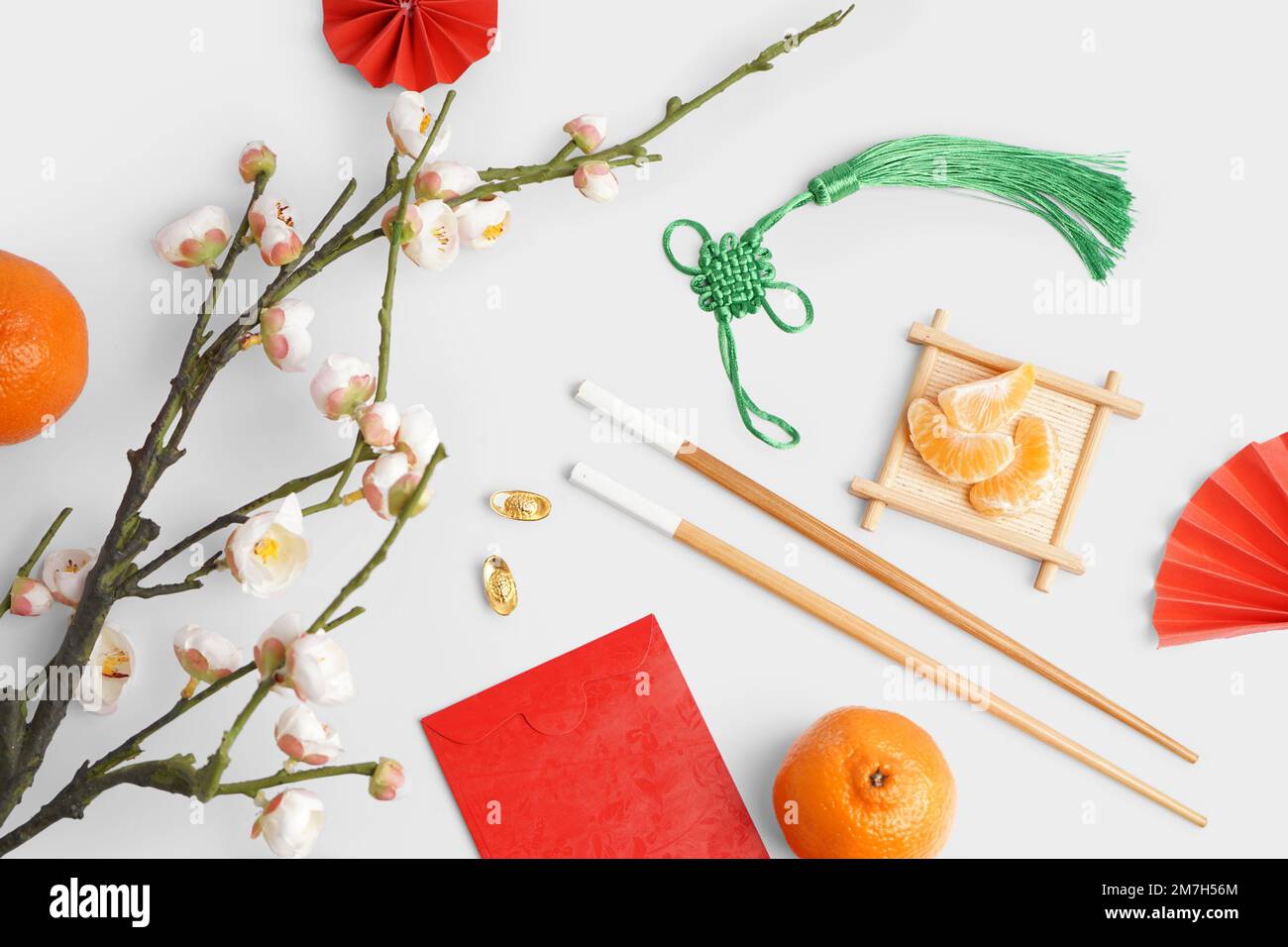 Red envelope, mandarins and Chinese symbols on white background Stock ...