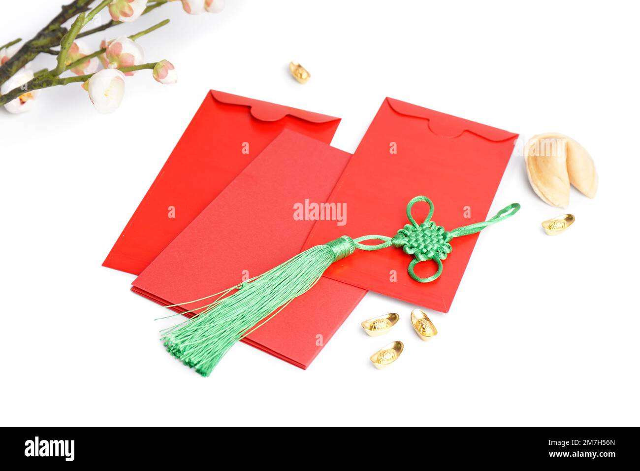 Red envelopes, fortune cookie and Chinese symbols on white background ...