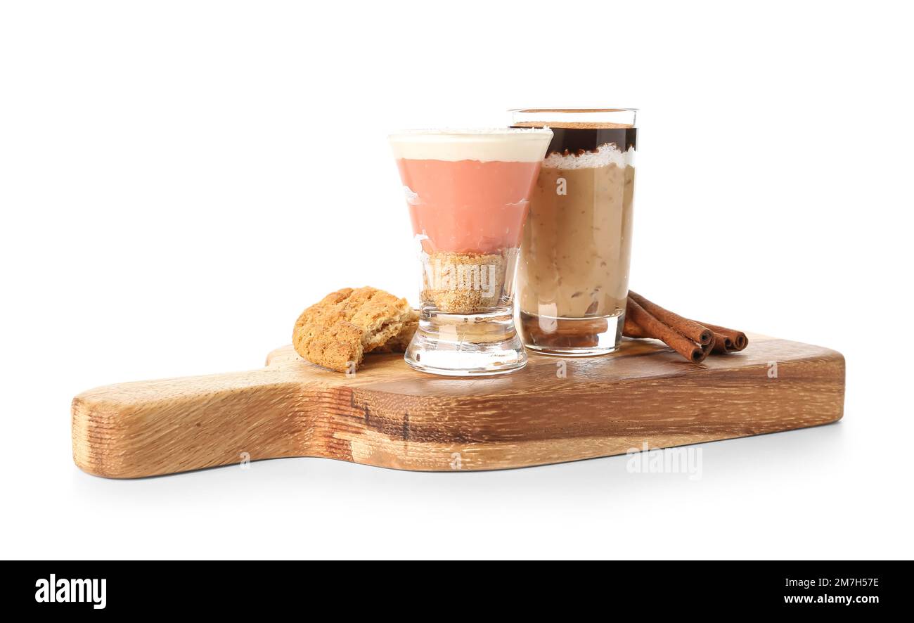 Board with shots of pudding with cookie pieces and cinnamon isolated on ...
