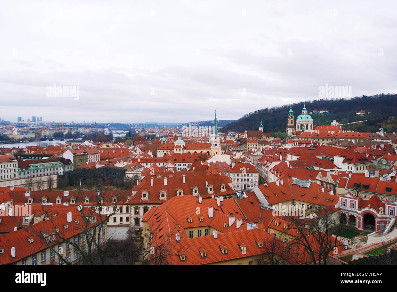A drone shot of a cityscape with mountain in the background under ...
