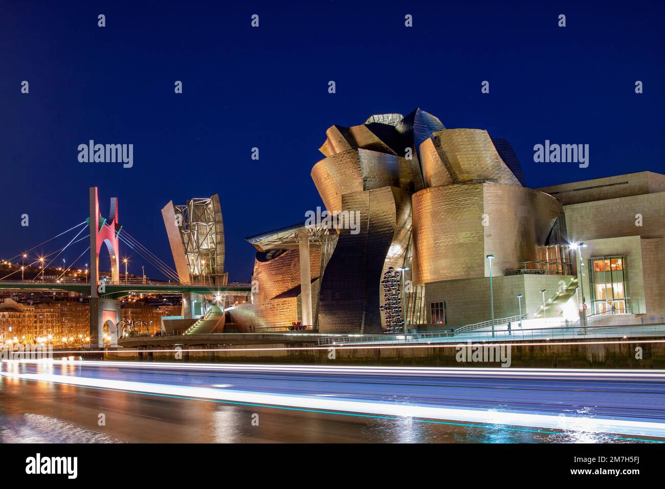 Night view of Guggenheim museum over the Nervion river estuary. Bilbao ...