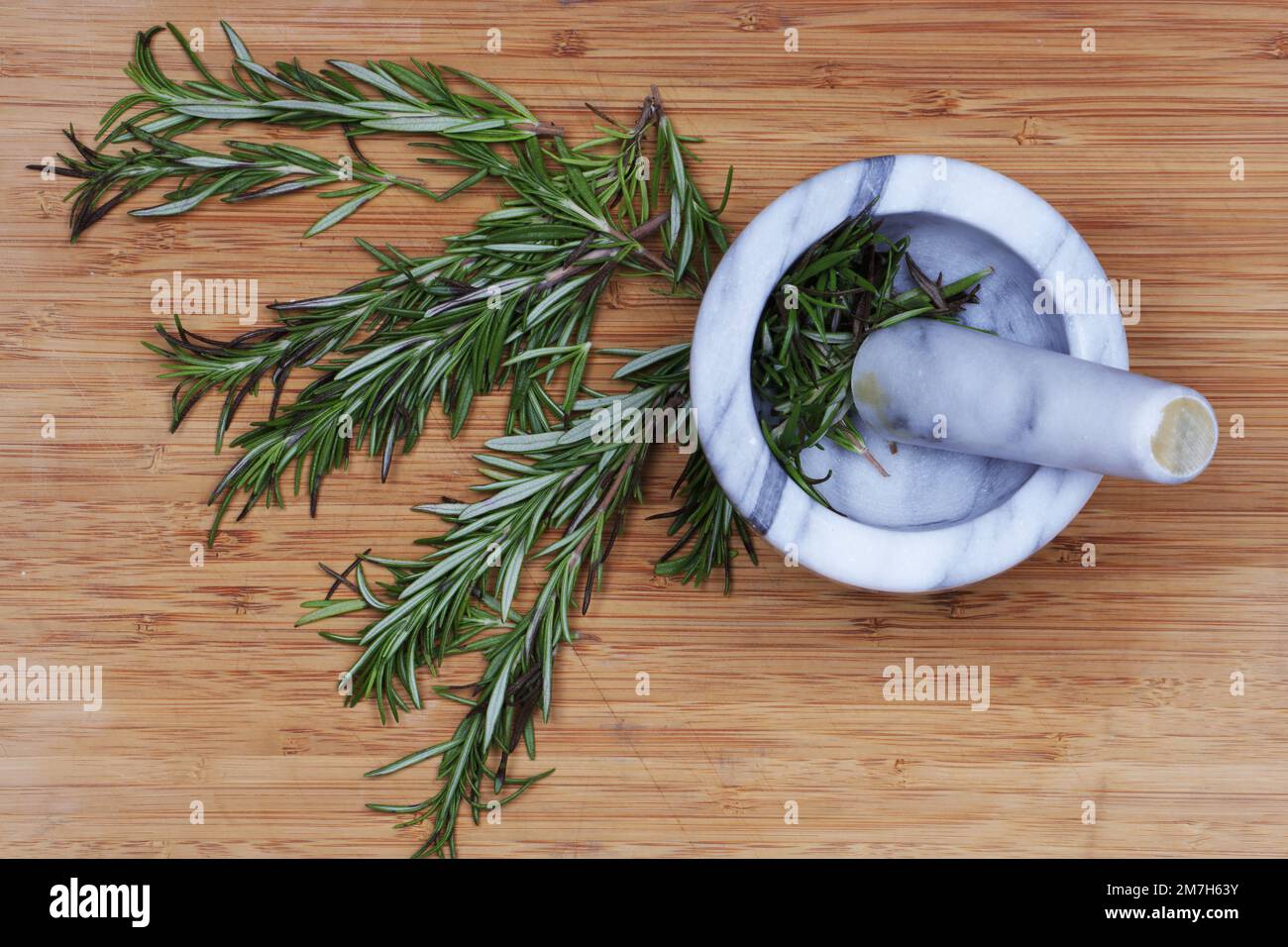 Mortar and pestle with rosemary herb from above Stock Photo - Alamy