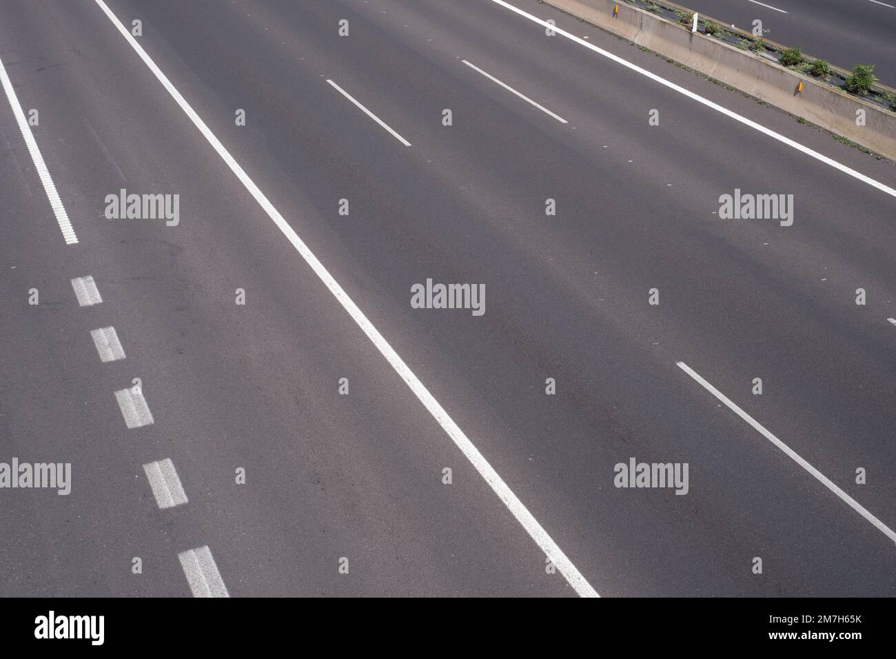 Road markings, marking different lanes, asphalt floor of a highway ...