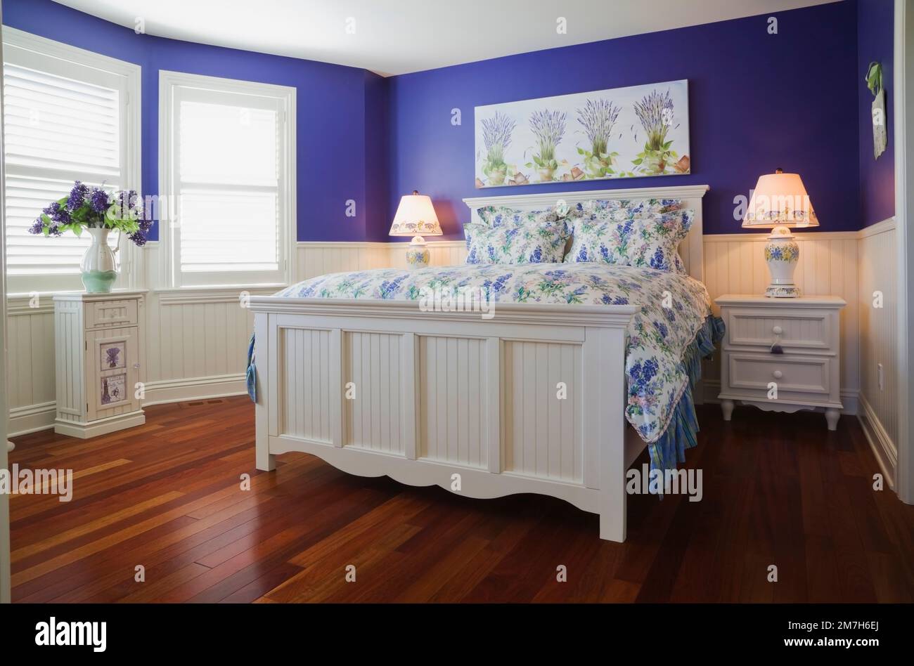 White wooden queen size bed with night tables in lavender with white ...