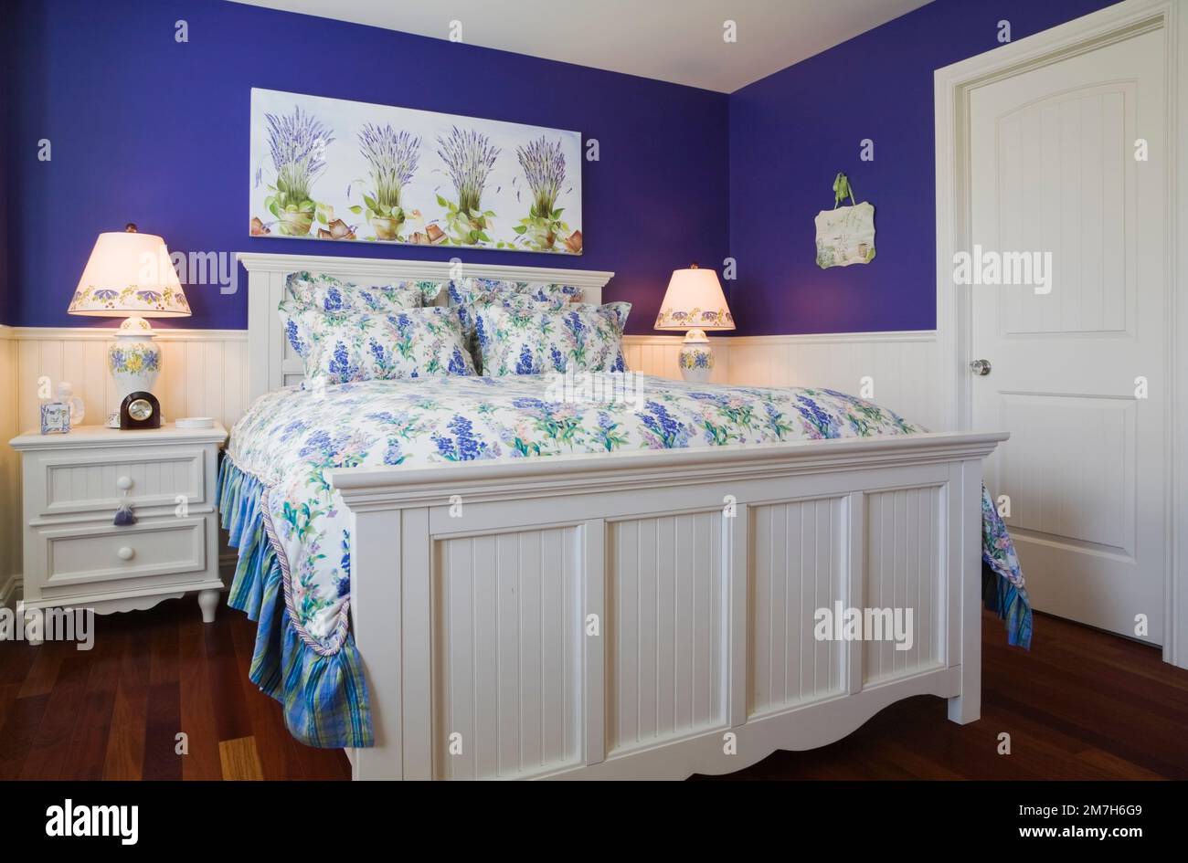 White wooden queen size bed with night tables in lavender with white ...