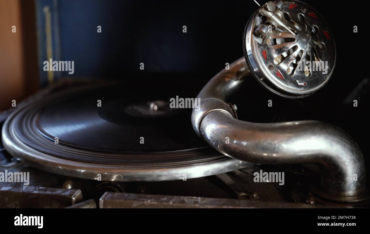 An old gramophone plays a musical record on a vinyl record. old ...
