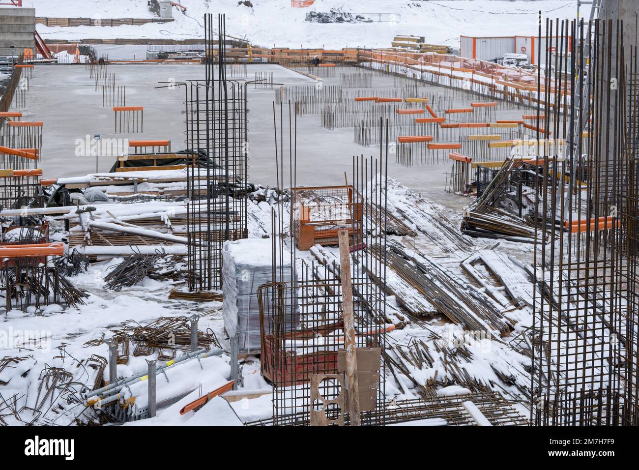 Beginning Laborers work Concrete pillars on the construction site in ...
