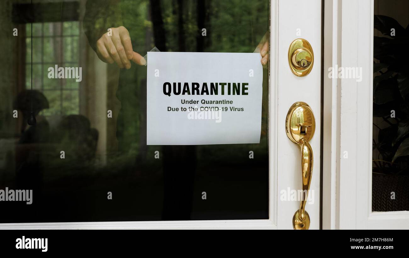 Coronavirus pandemic notice. Man hangs Covid-19 virus self quarantine ...