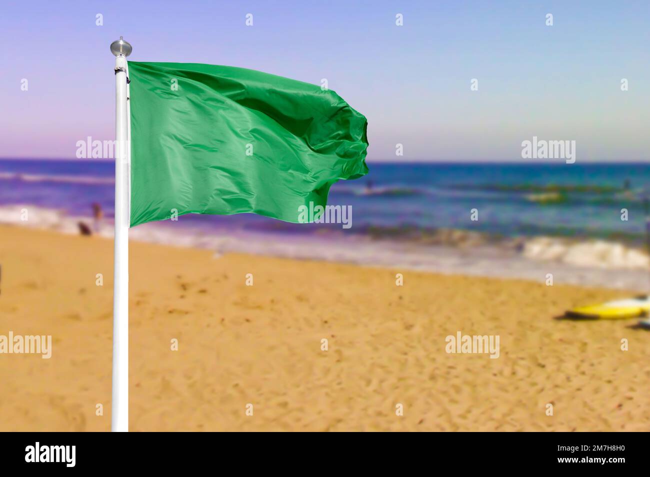Beach green flag weather wind advice Spain blue sea Stock Photo - Alamy