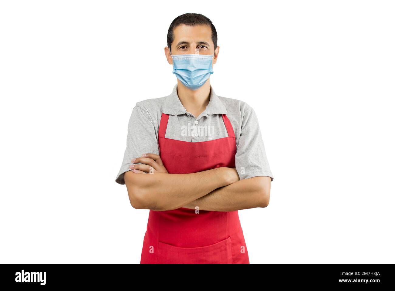 Business owner in red apron wearing a face mask to avoid coronavirus ...