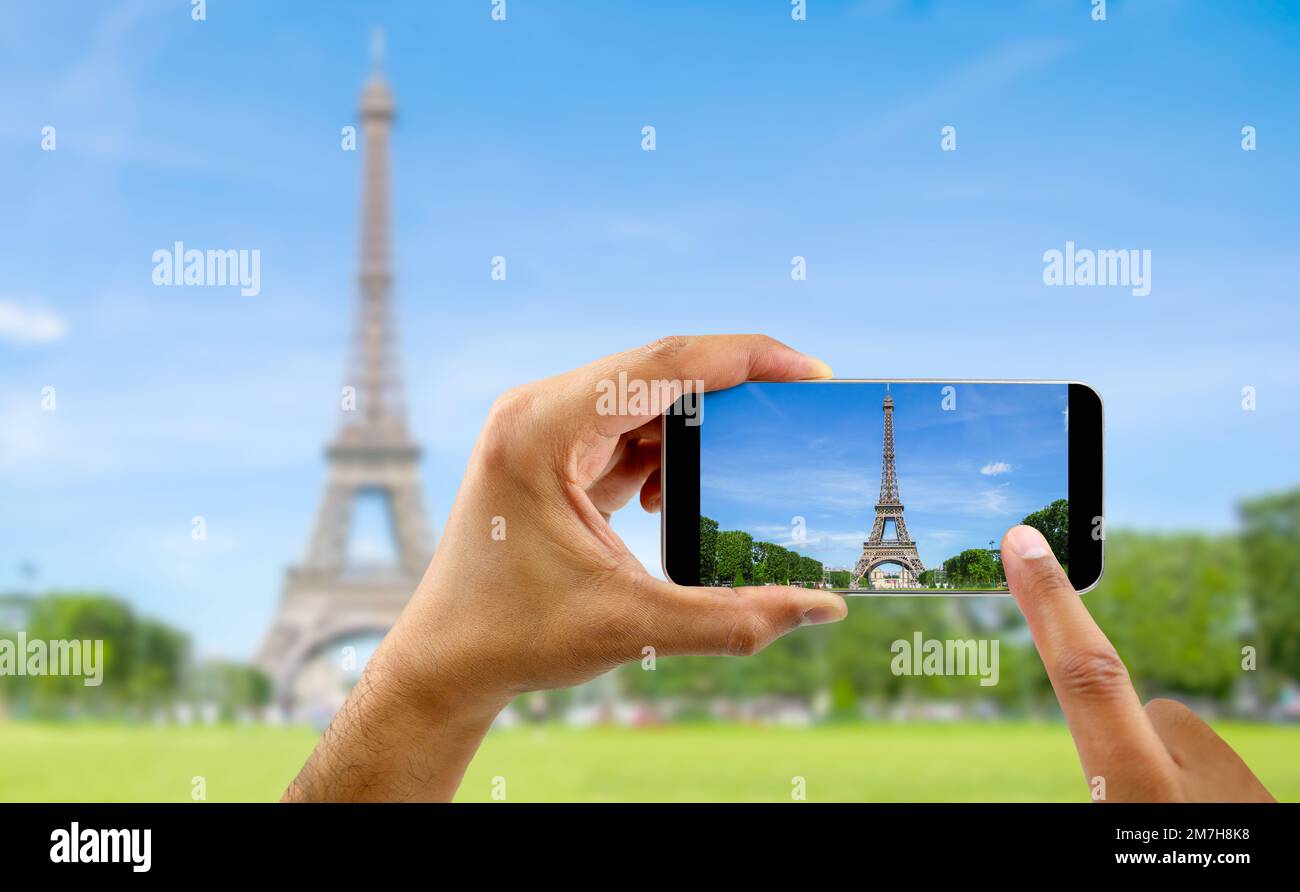 Tourist in Paris visiting landmark Eiffel tower, sightseeing in France ...