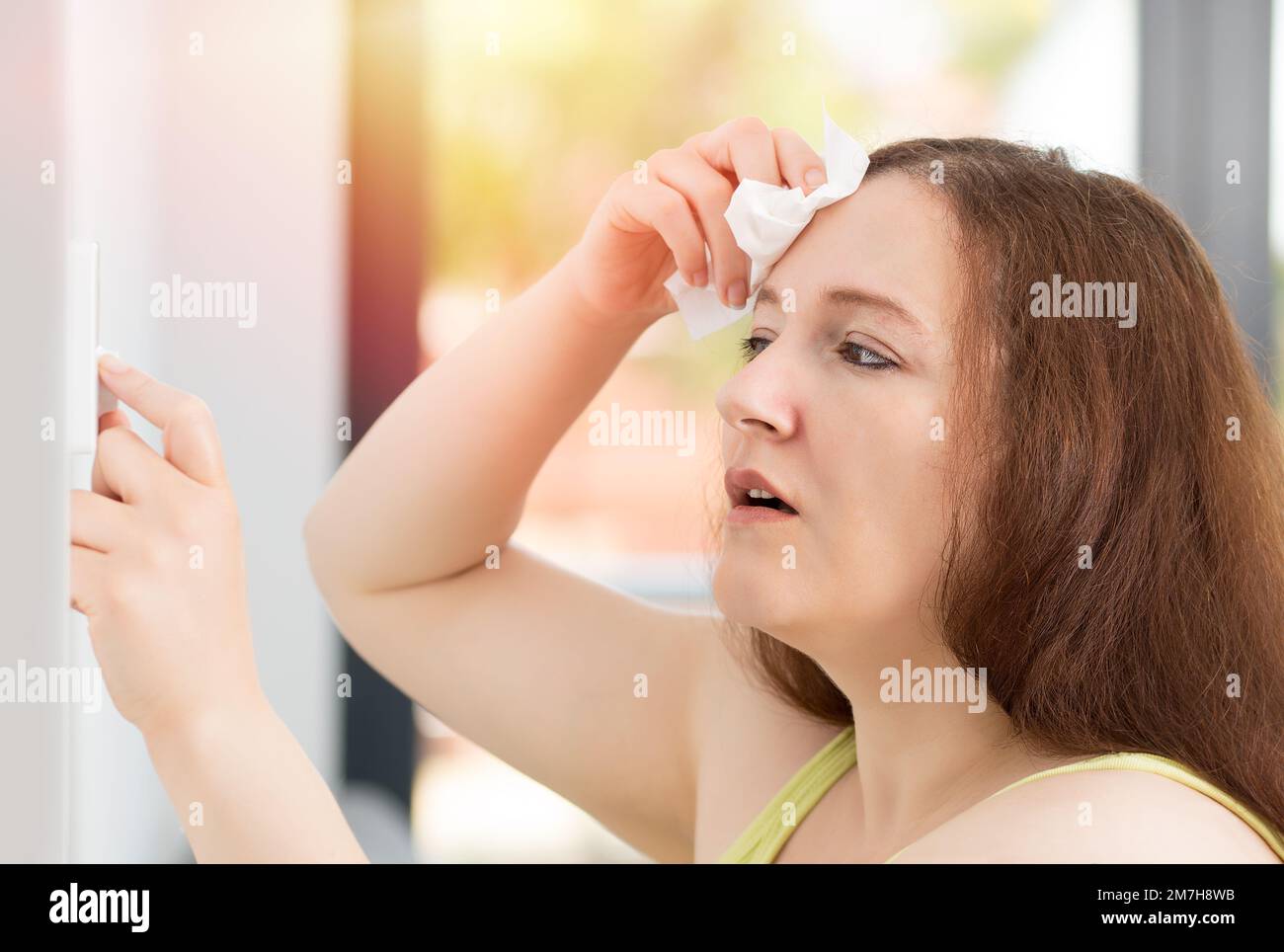 Shot of a side view portrait of a sad woman push button digital ...
