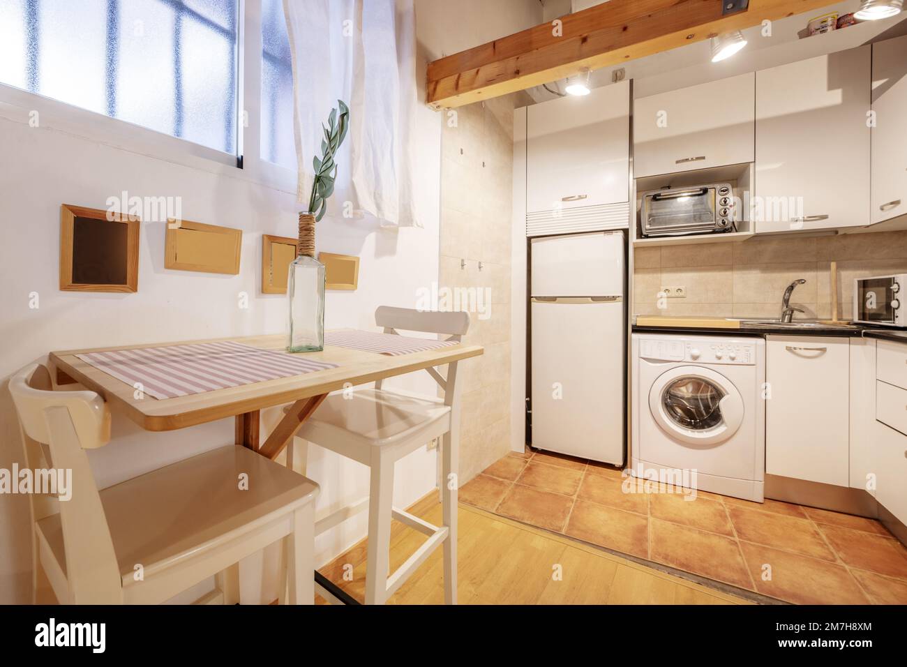 Cozy studio apartment for vacation rental with kitchen open to living ...