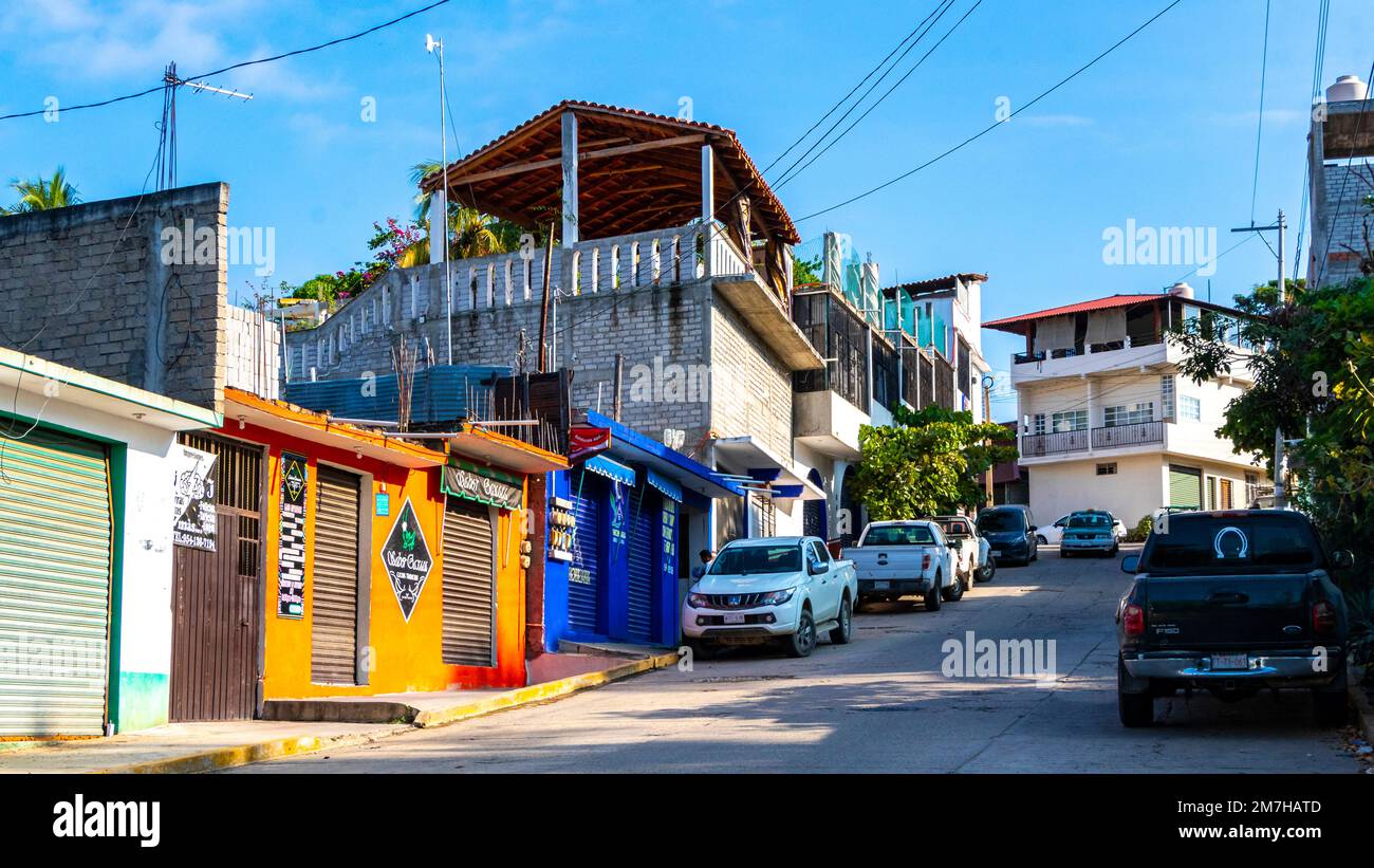 Colorful streets cars high traffic stores people buildings and trade in ...