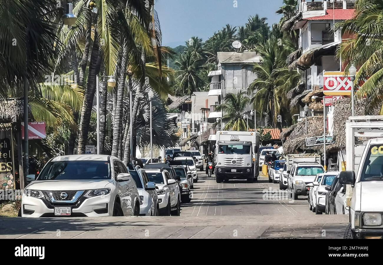 Colorful streets cars high traffic stores people buildings and trade in ...