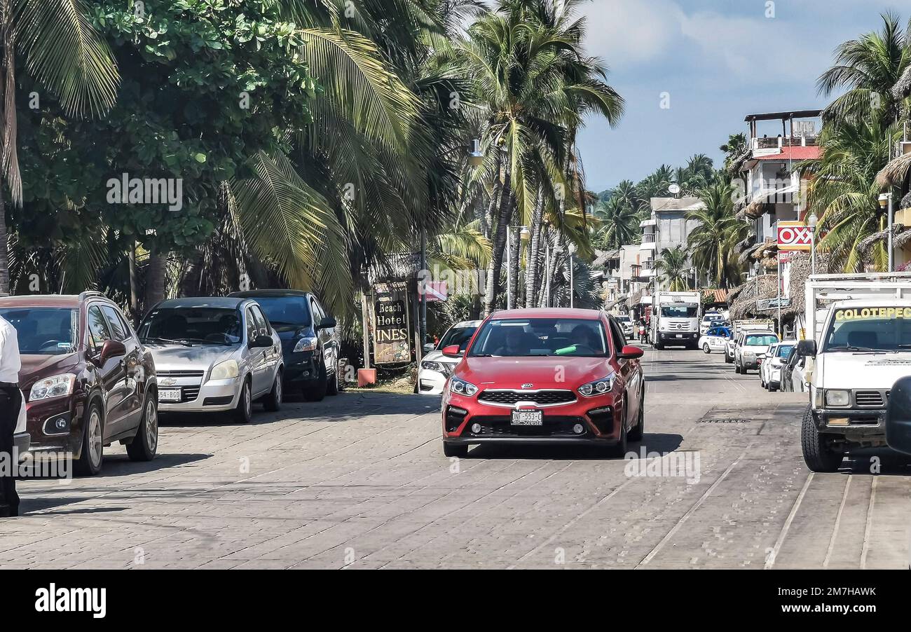 Colorful streets cars high traffic stores people buildings and trade in ...