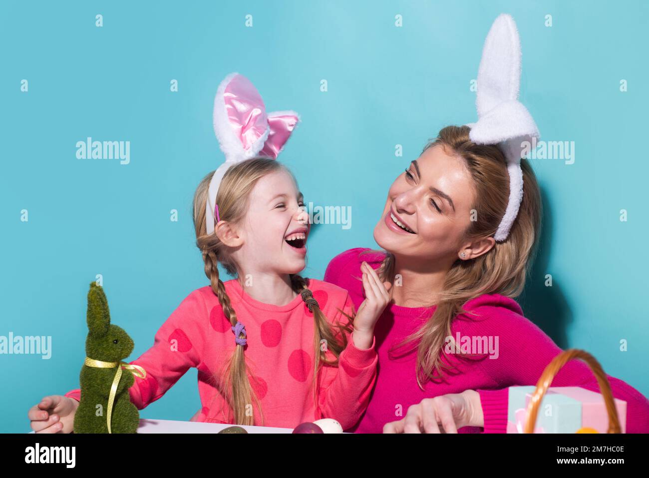 Family happy easter. Mom with daughter are preparing for Easter. Mother ...