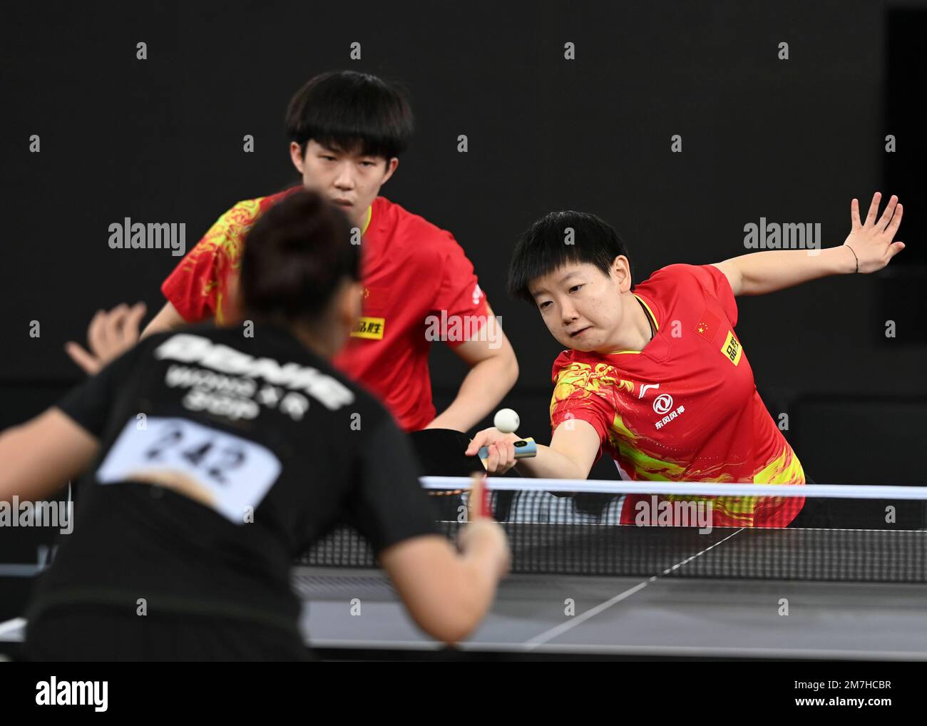 Doha, Qatar. 9th Jan, 2023. Wang Chuqin/Sun Yingsha (R) of China ...
