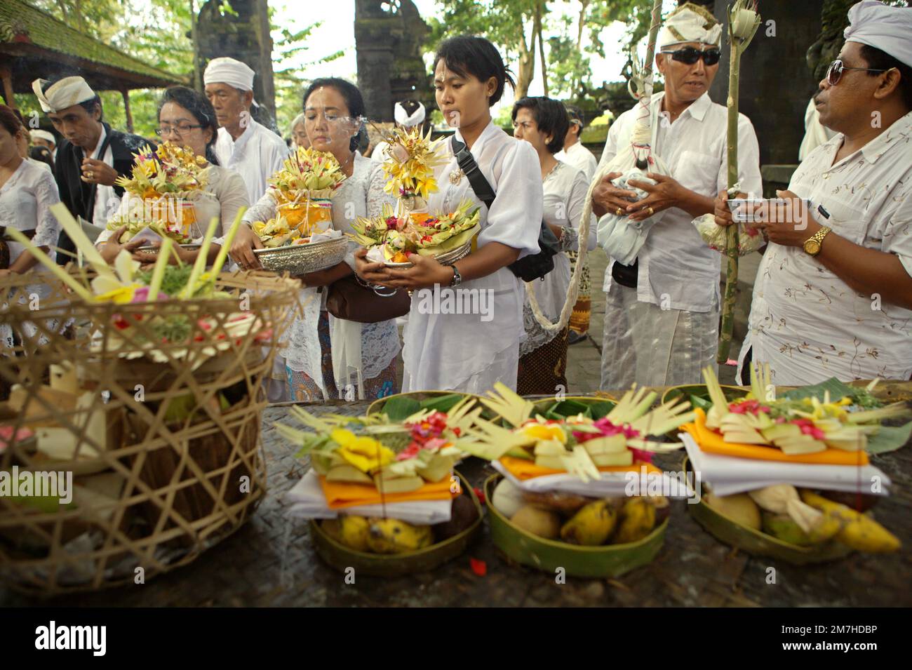Women of a Balinese clan are carrying spiritual offerings during a ...