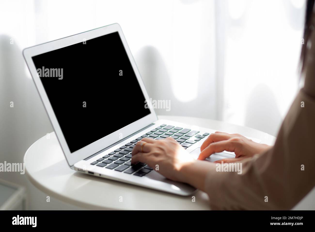 Young asian woman work from home with laptop computer blank screen mockup, freelance is female ...