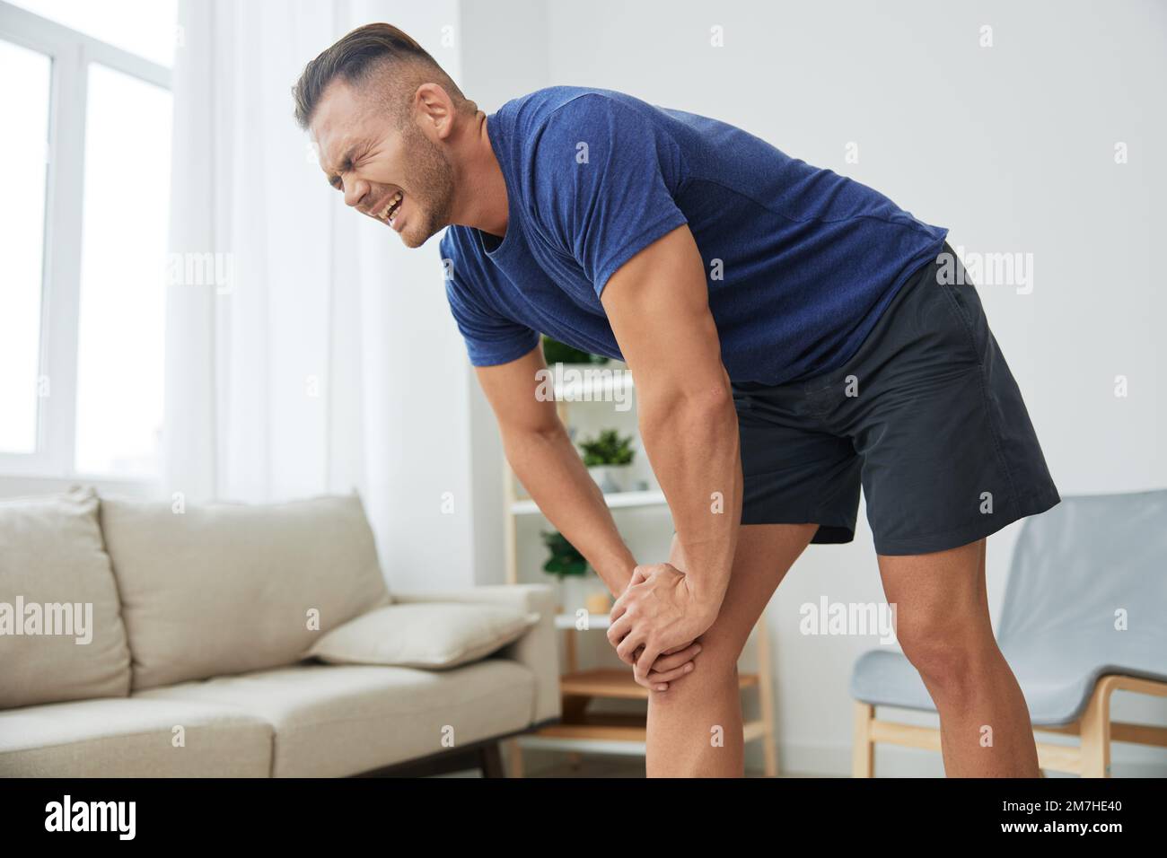 Man leg pain from exercising at home, workout injury, muscle and ...