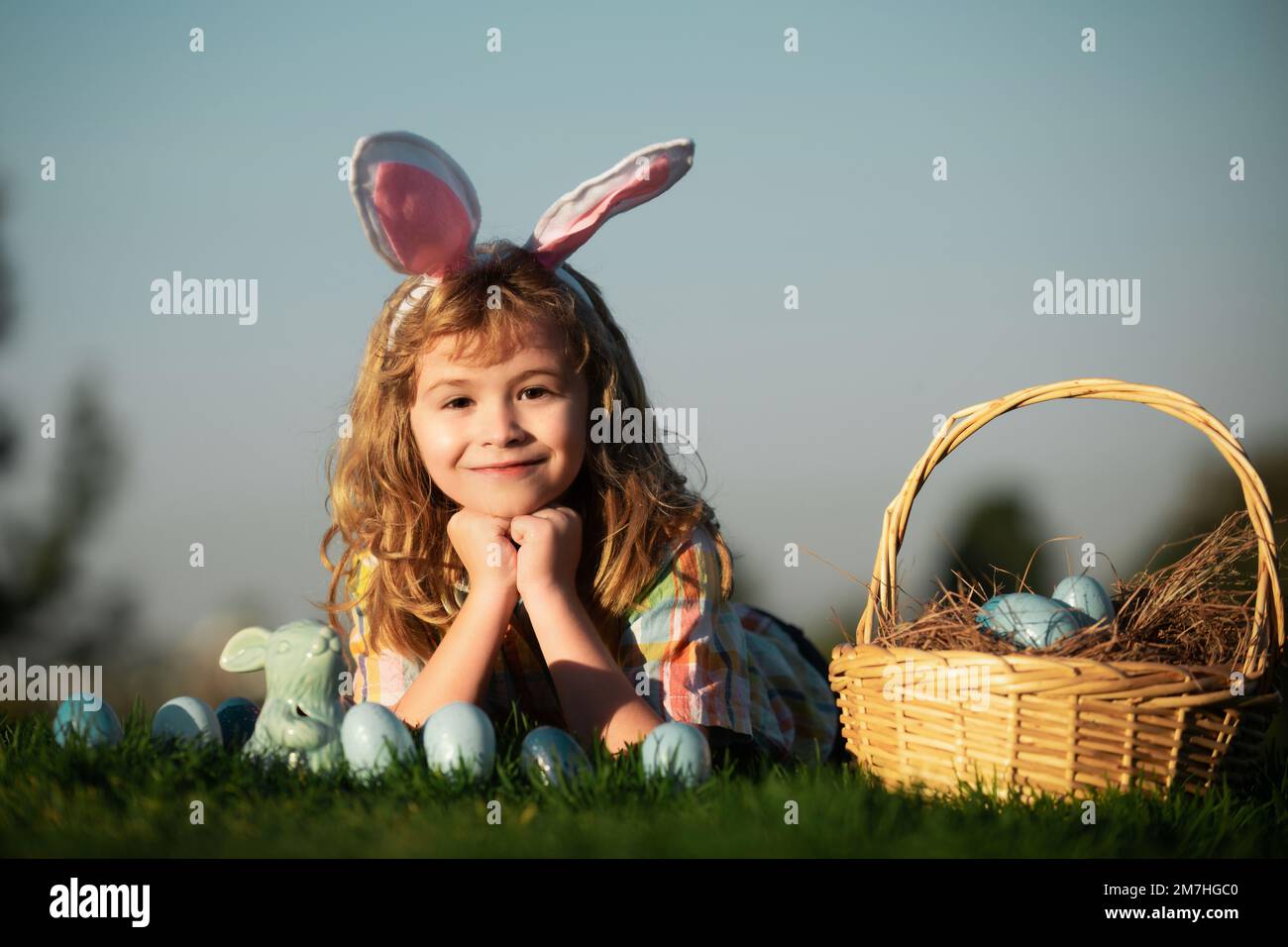 Easter egg hunt in garden. Child boy playing in field, hunting easter ...