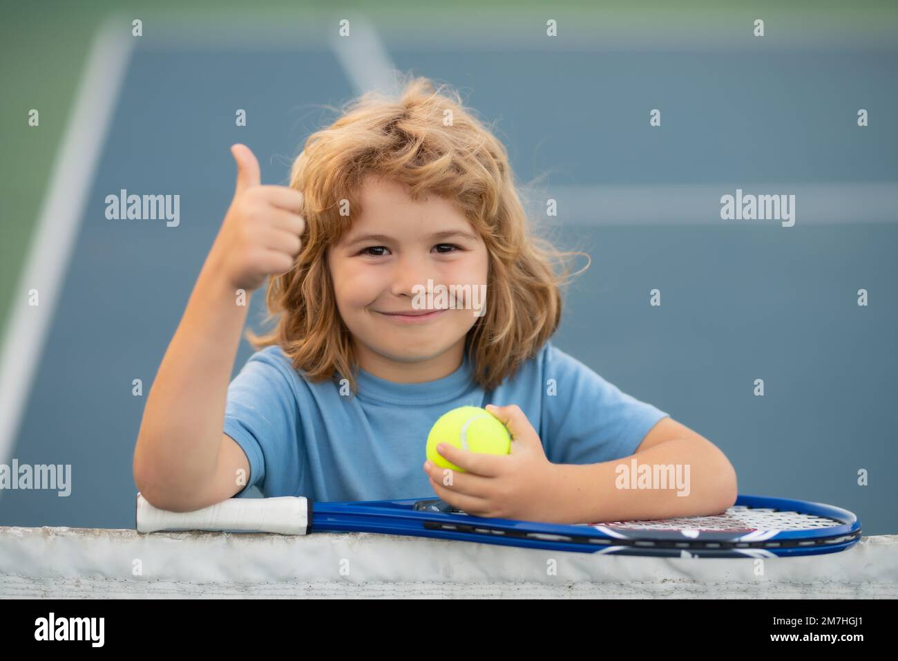 Tennis. Child playing tennis on indoor court. Little child with tennis ...