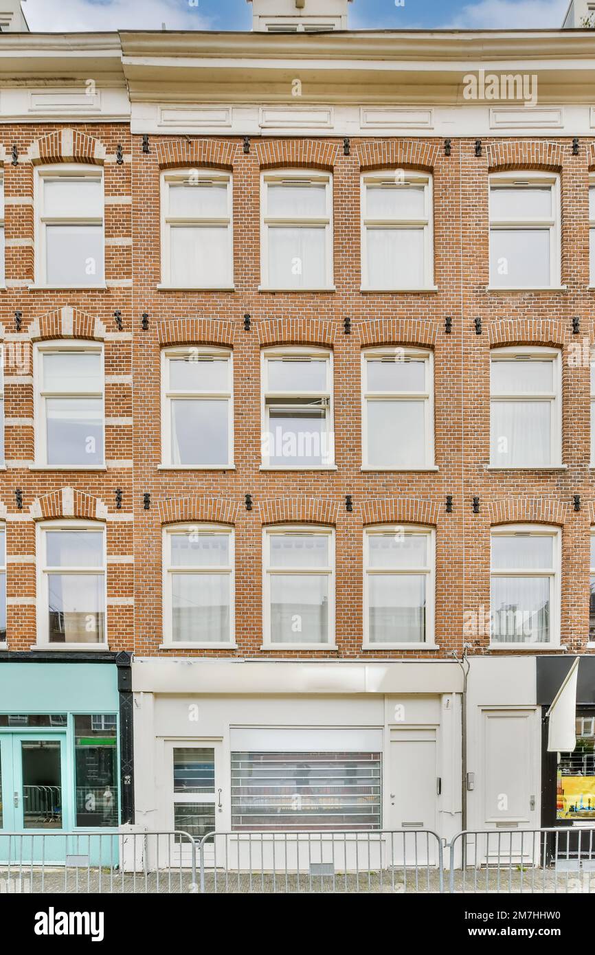 a brick building with many windows on the top and bottom, as seen from ...
