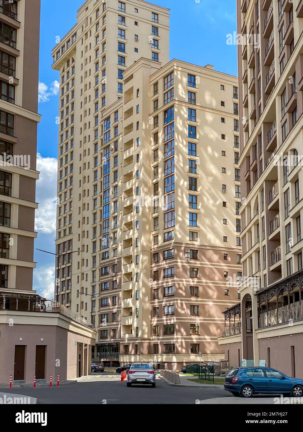 modern apartment complex in sunny summer day. sunlight reflection from ...