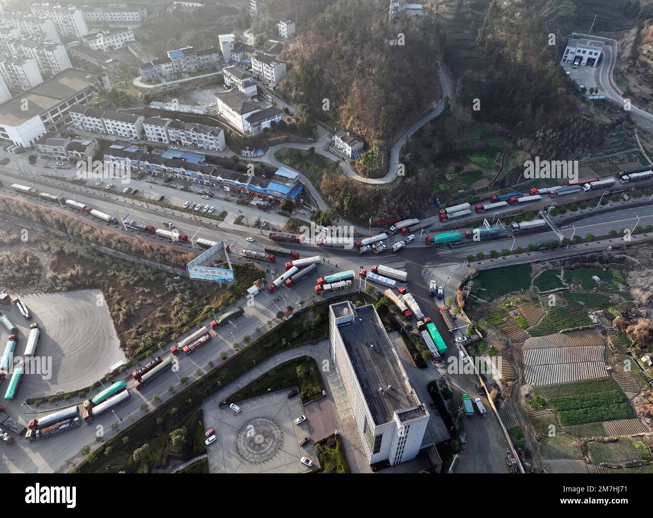 Aerial photo shows trucks waiting for boarding a ship at the Yinxingtuo ...