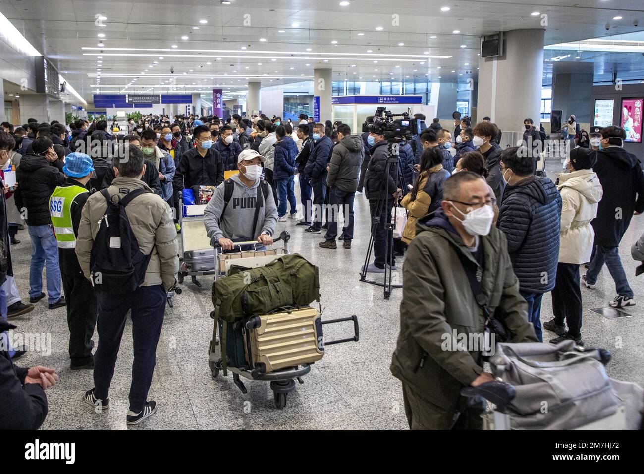Inbound passengers walk out of the entry passage in the international ...
