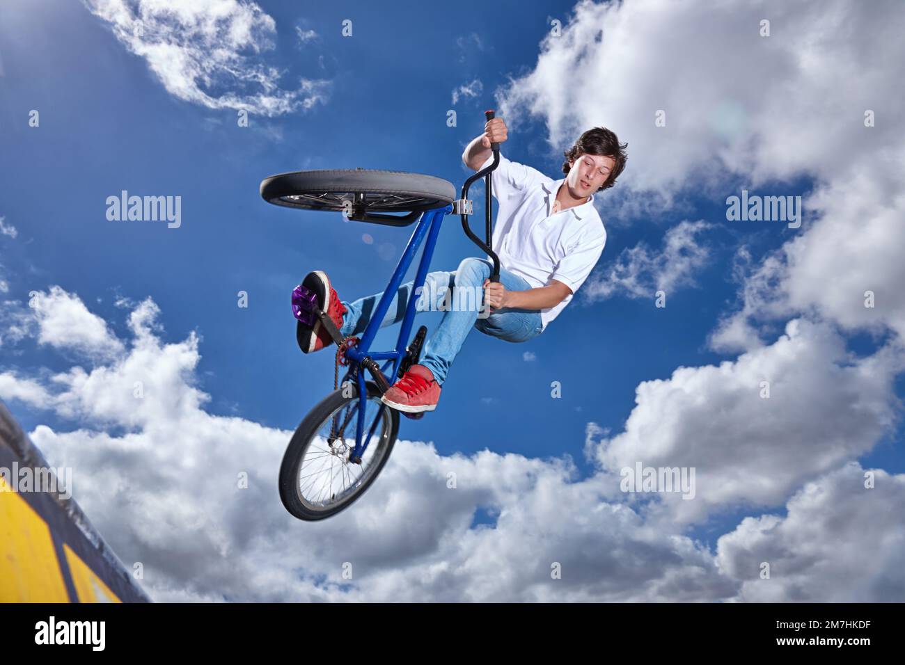Practicing for the x games. Full length shot of a teenage boy riding a ...