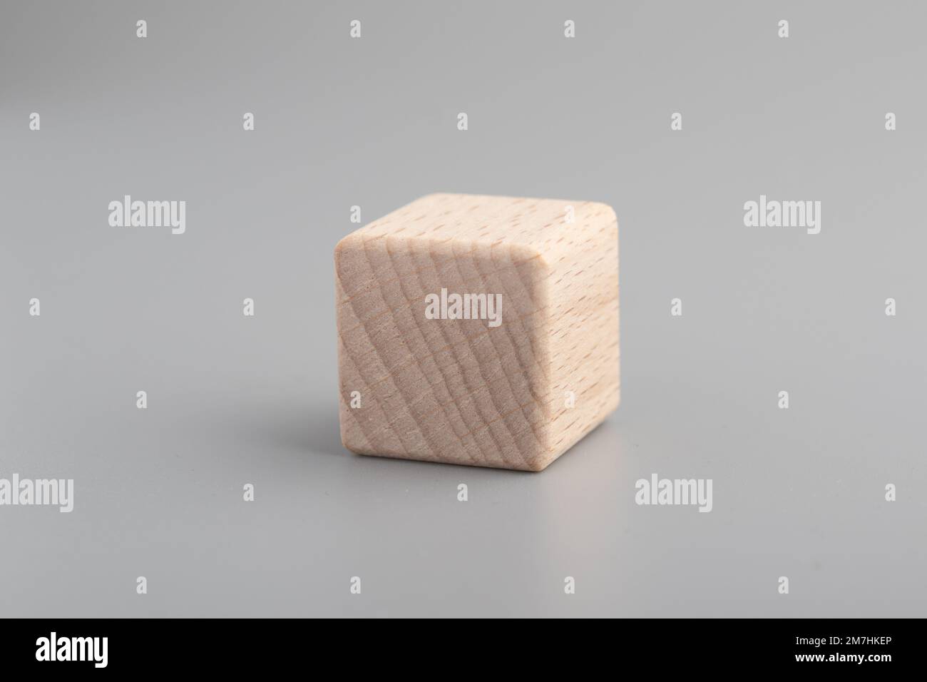 Simple empty wooden dice, one blank cubes made of wood with one central ...