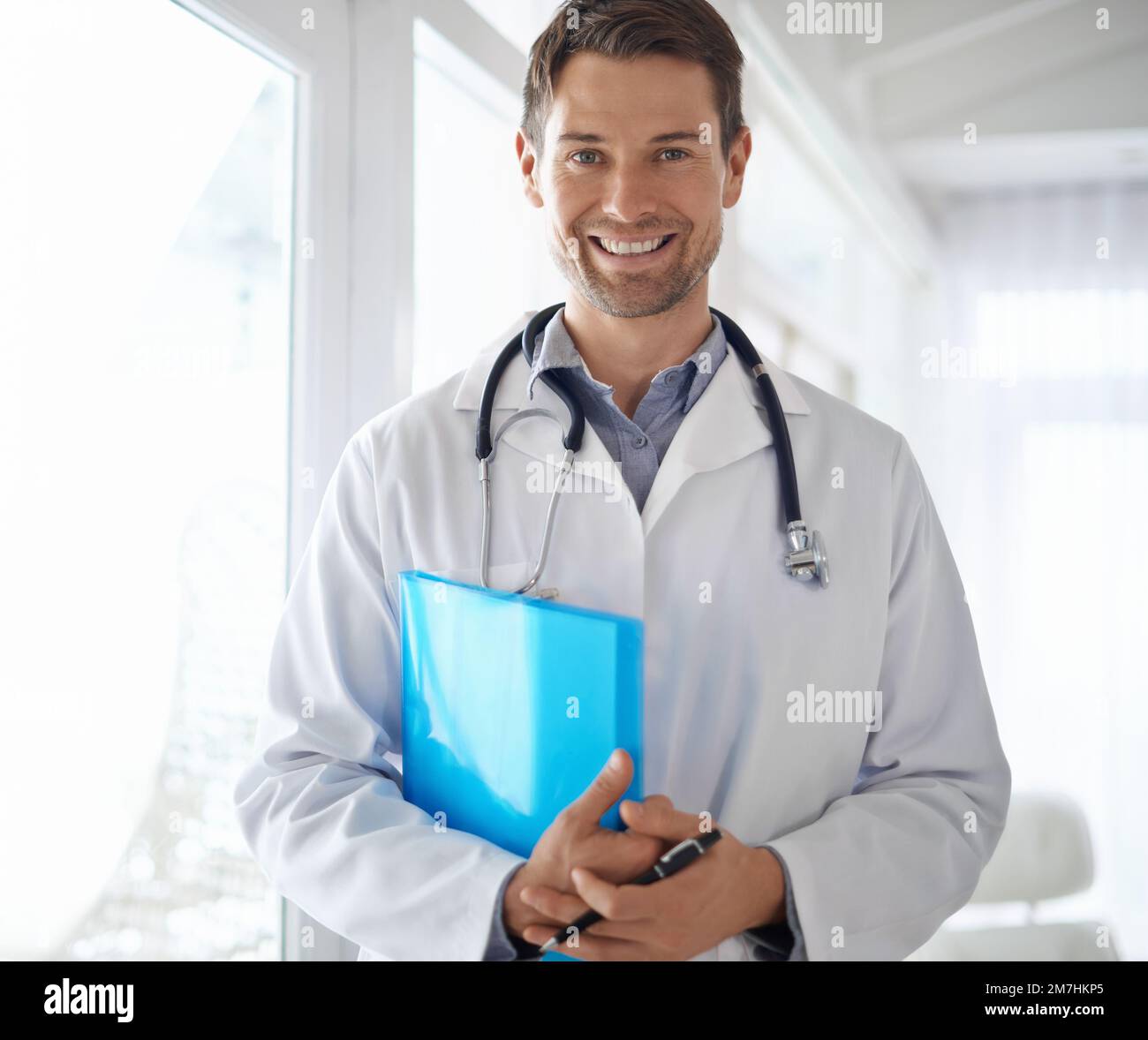 Healthcare you can trust. Portrait of a handsome male doctor standing ...