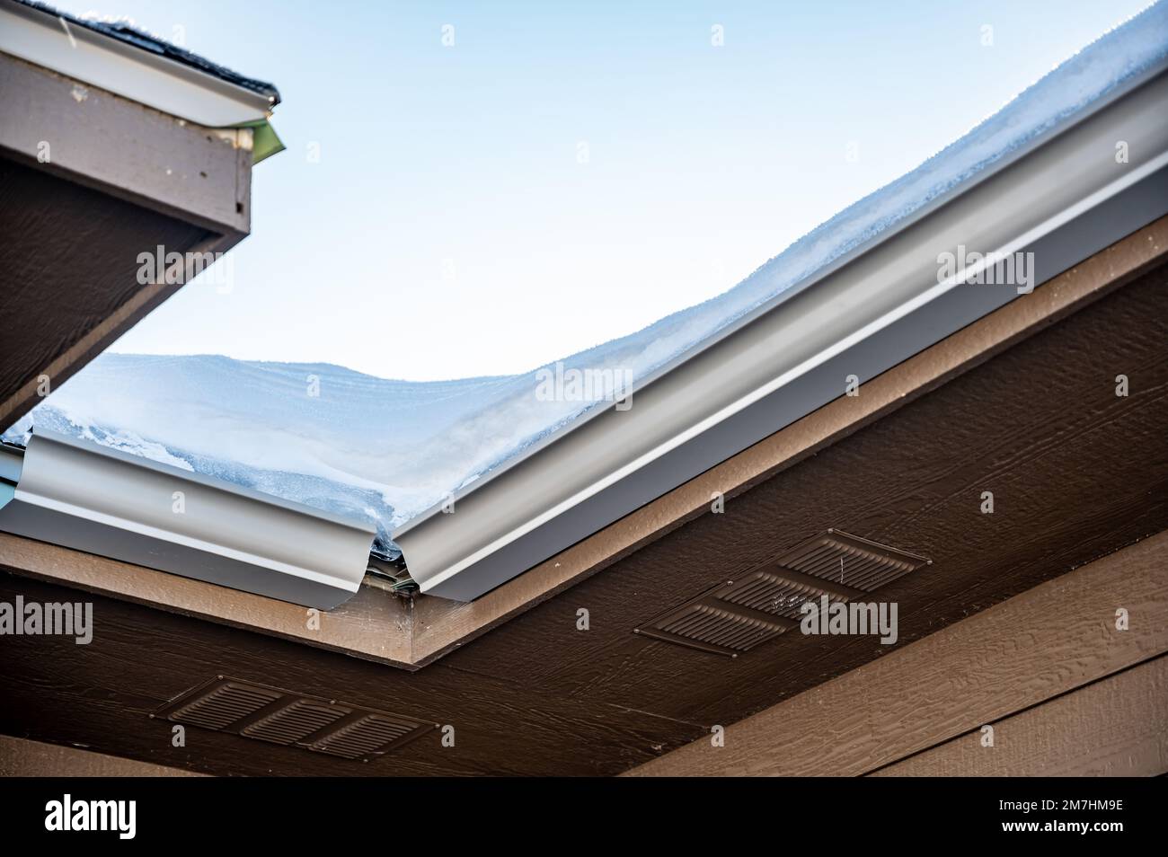 Metal gutters be installed on a residential buildings with two sections ...