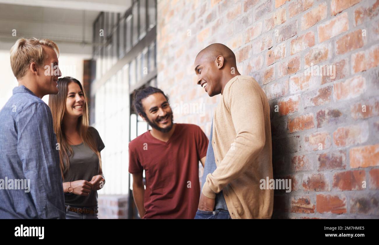 Taking it easy after a long lecture. a diverse group of friends ...