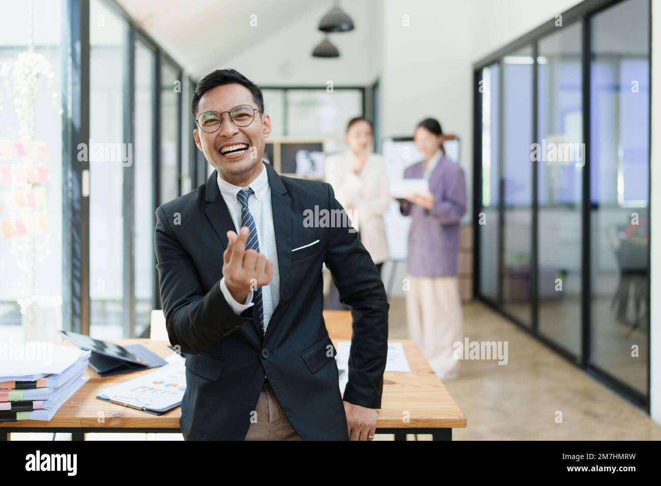 Portrait of a male business owner showing a happy smiling face as he ...
